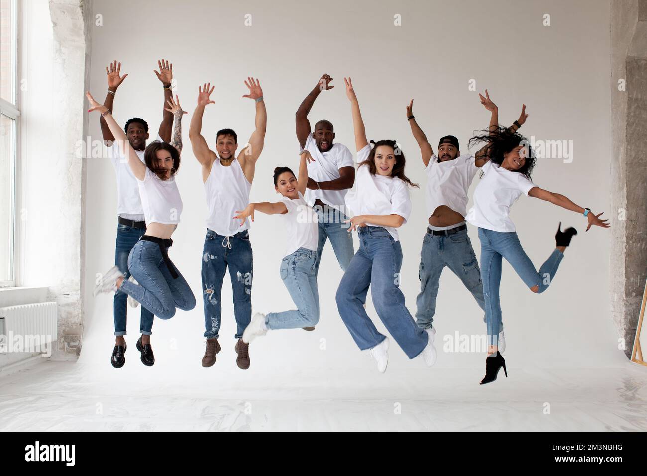 Group of young diverse People dancers jumping on white background in ...