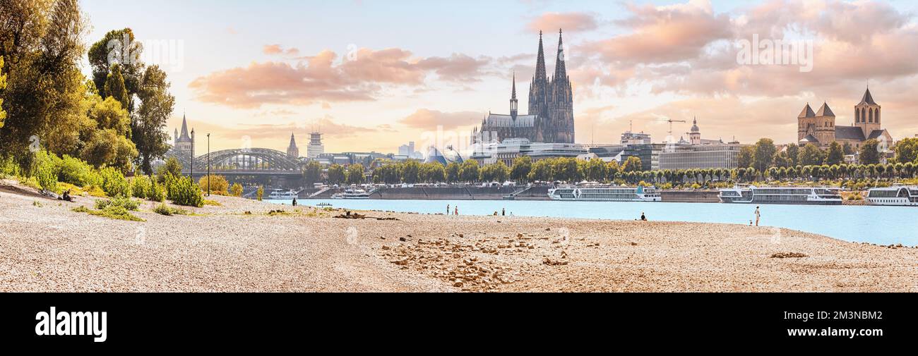 Panoramic view of the Rhine River beach and the Cologne skyline with ...