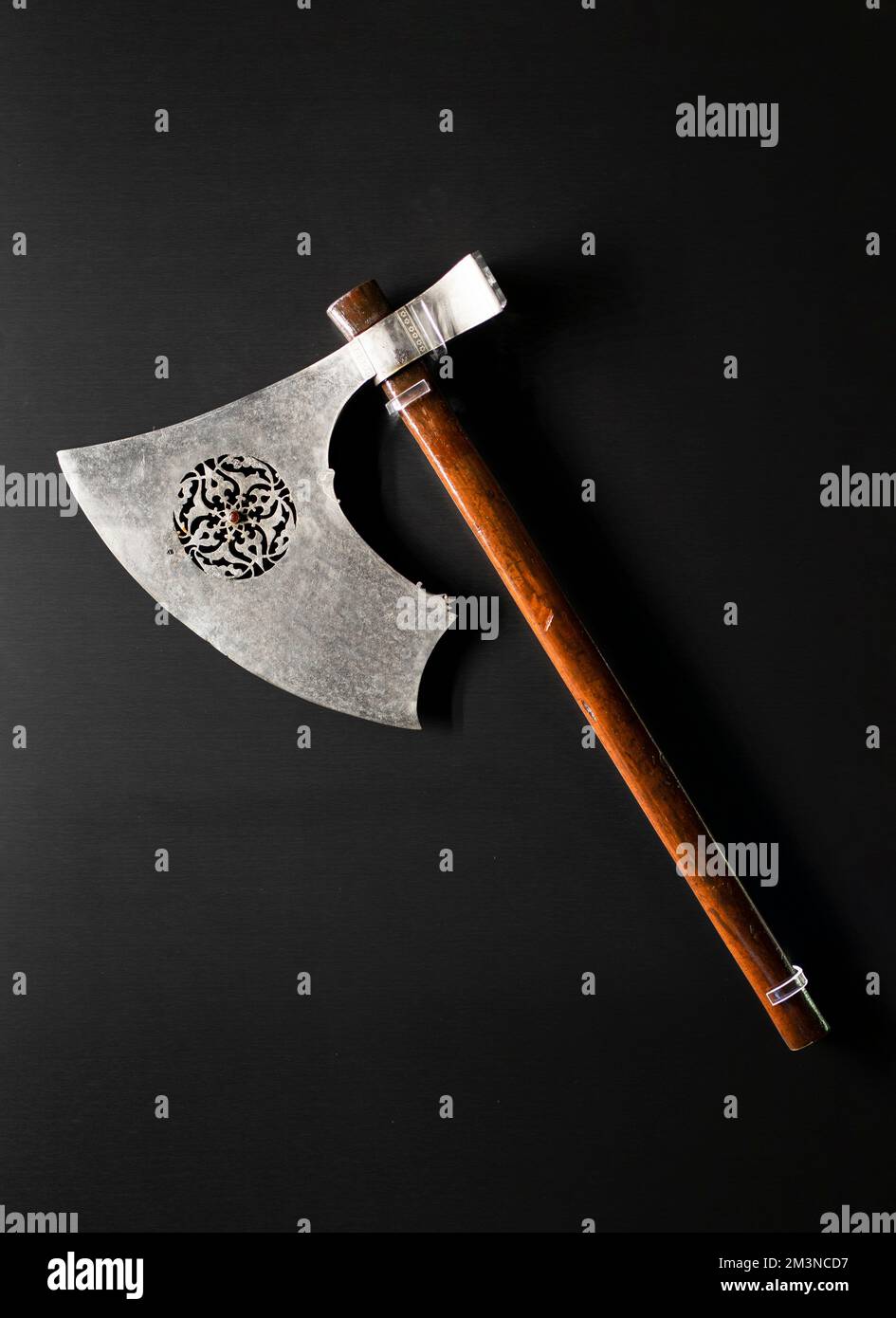 Antique medieval old axe with wooden handle isolated on black ...