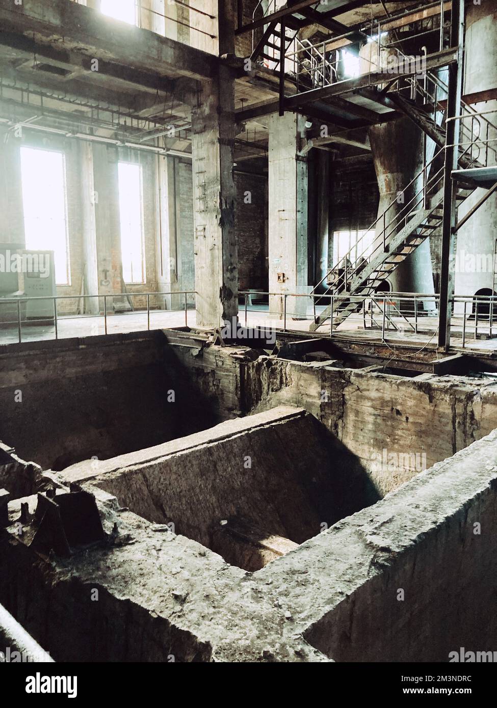 Abandoned factory with old walls and metallic stairs Stock Photo - Alamy