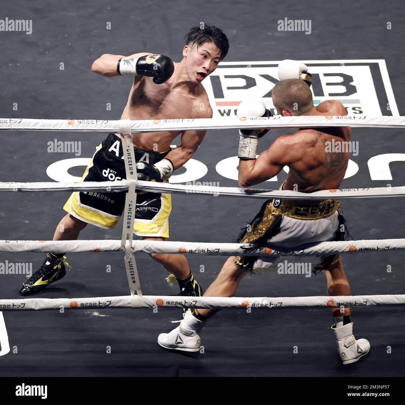 Japan's Naoya Inoue (L) backs Britain's Paul Butler up against the ...