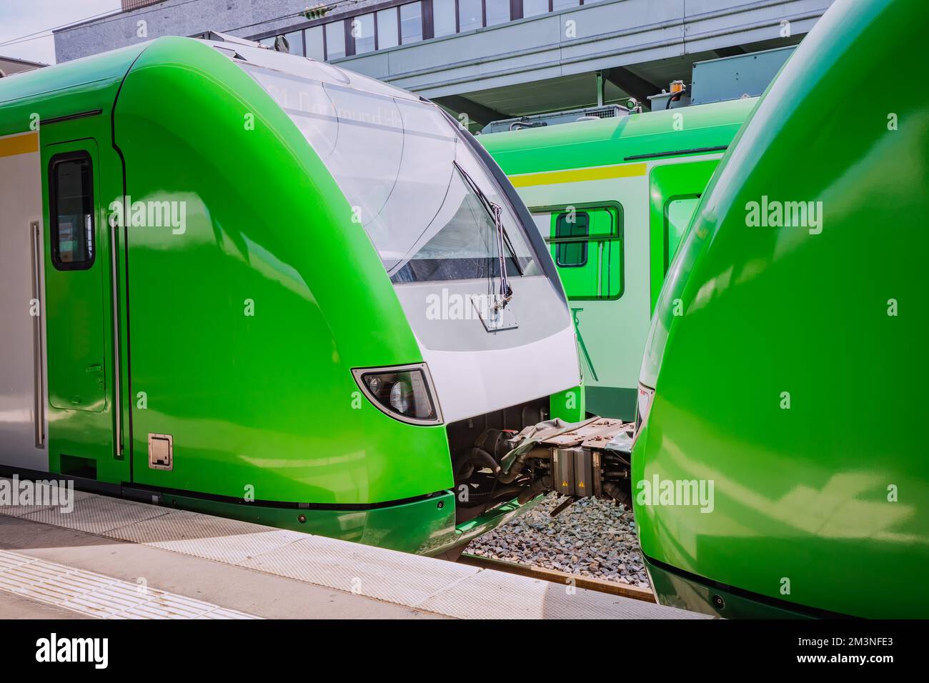 A modern high speed intercity green train carries passengers. Public ...