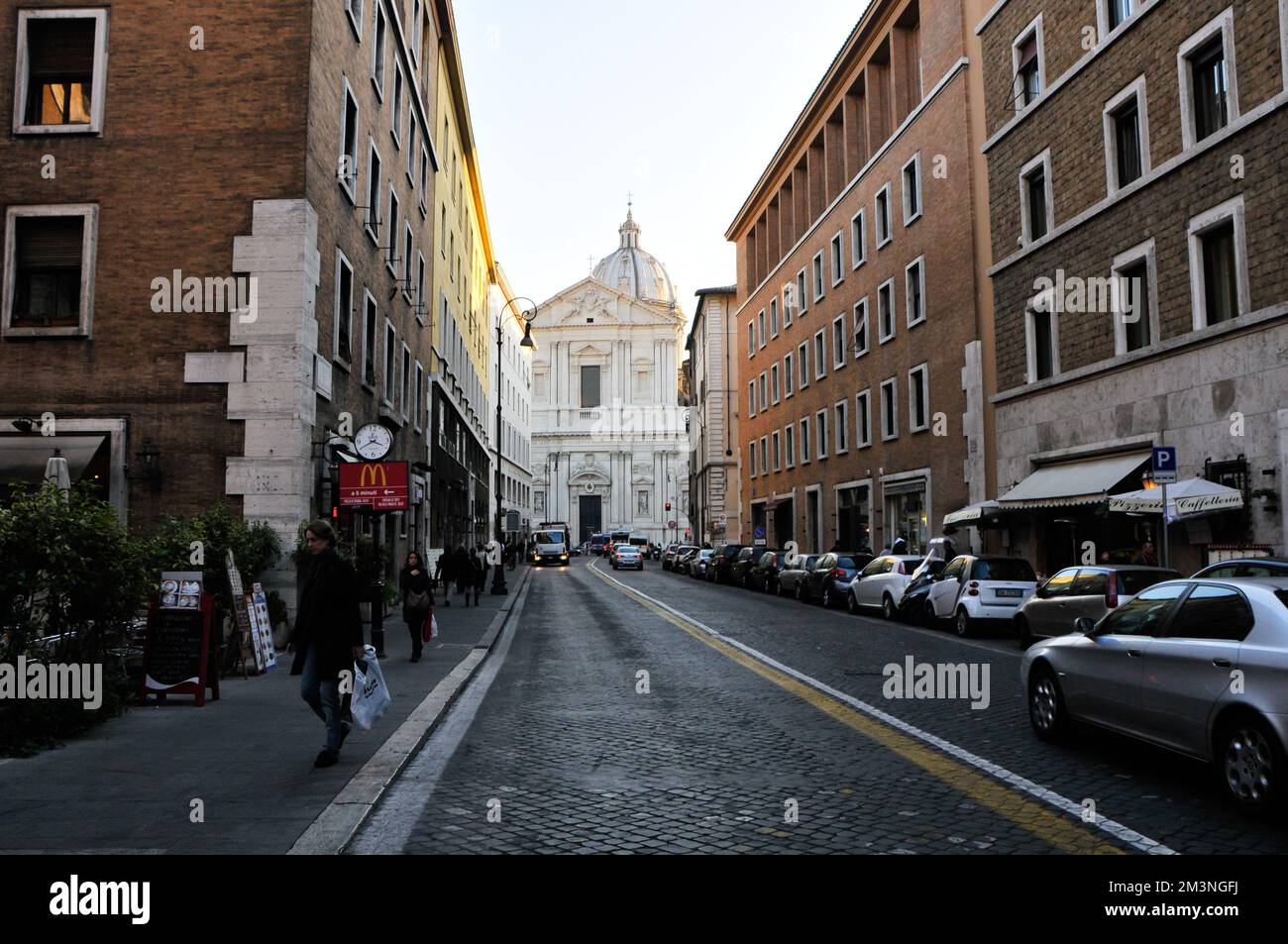 The Rome downtown with a church roof at the end Stock Photo - Alamy