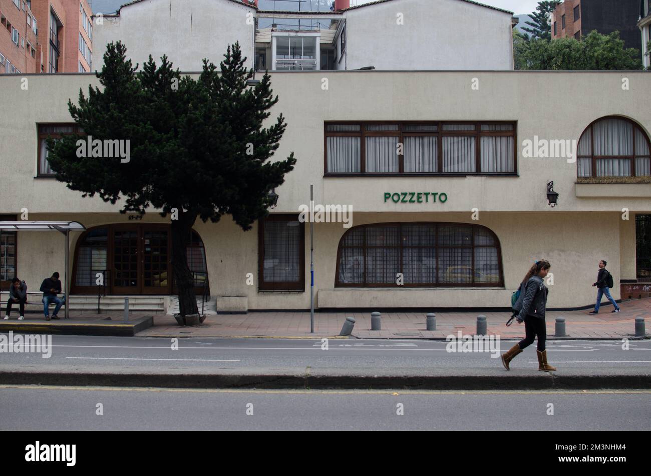 A female walking by a restaurant Stock Photo - Alamy