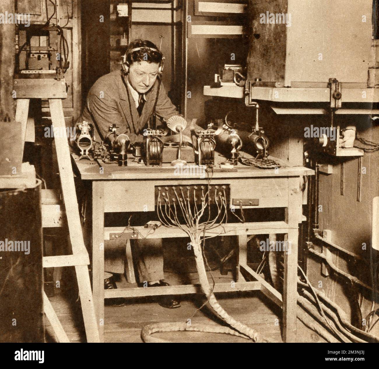 Dr J D Cockcroft listening for atomic disintegration Stock Photo - Alamy