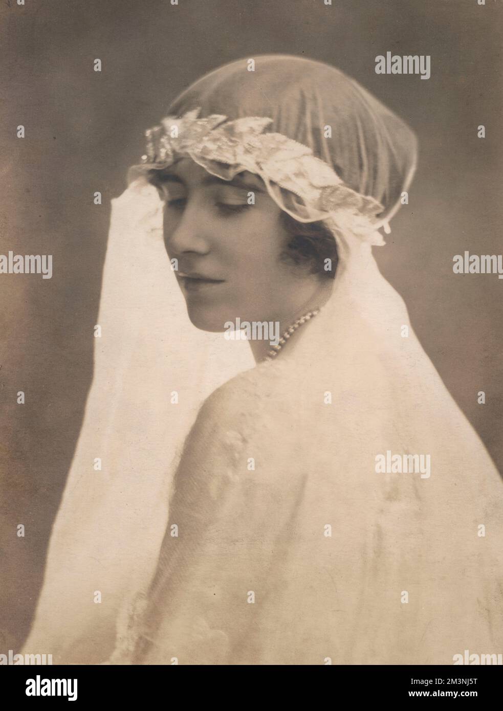 Lady Elizabeth Bowes-Lyon as a bridesmaid at the wedding of her future ...