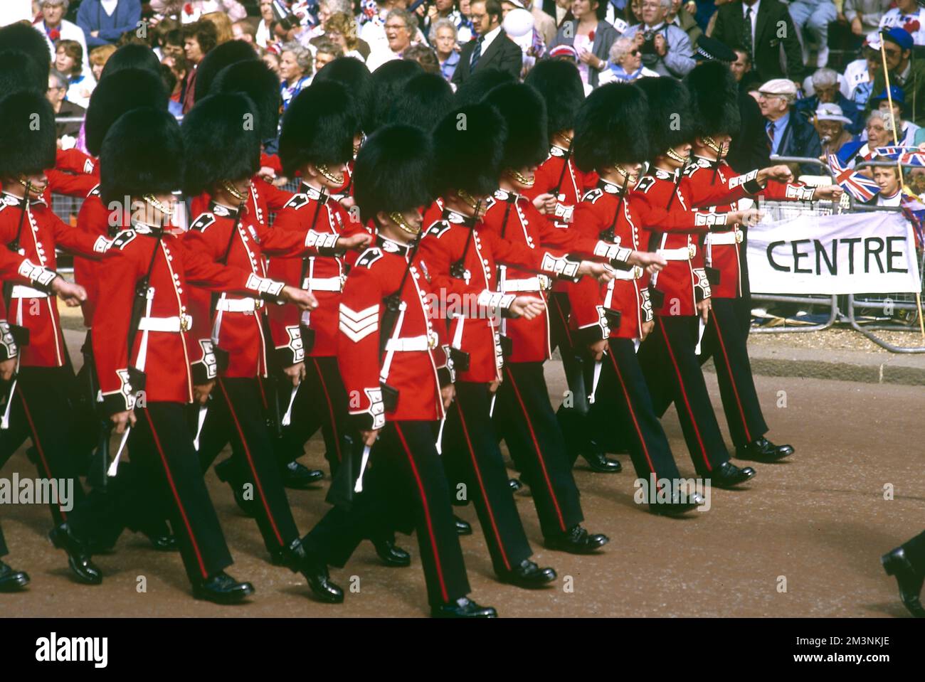 Guards in their famous bearskin helmets march in formation in the ...