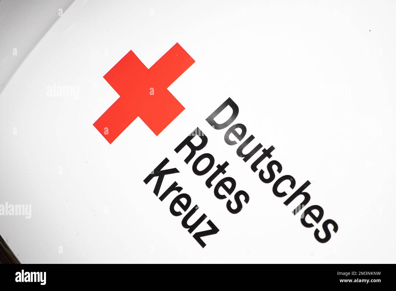 29 July 2022, Cologne, Germany: German Red Cross emblem on a ambulance ...