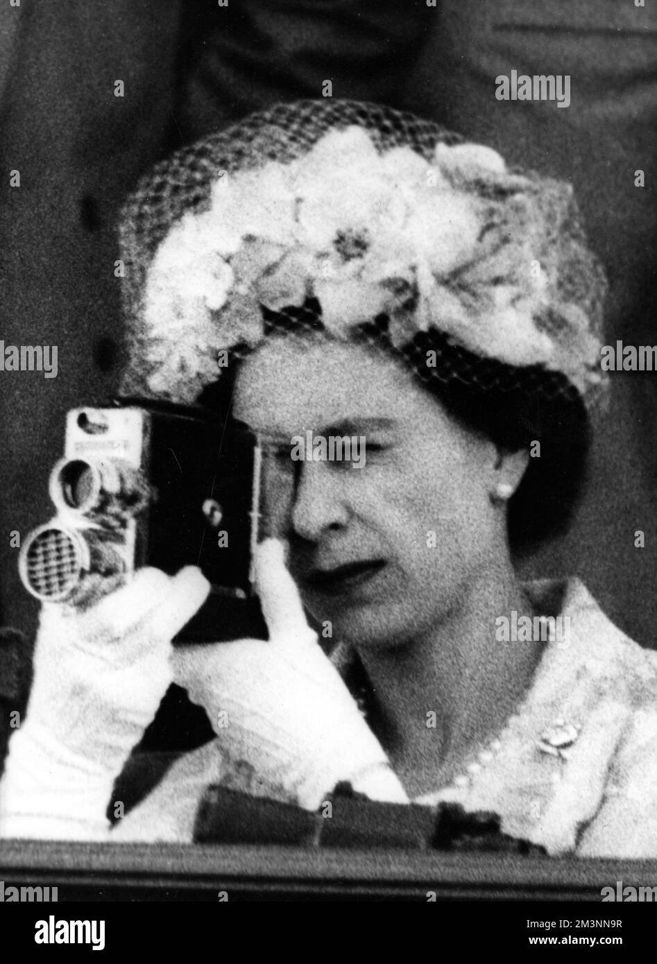 Queen Elizabeth II using a cine camera Stock Photo - Alamy