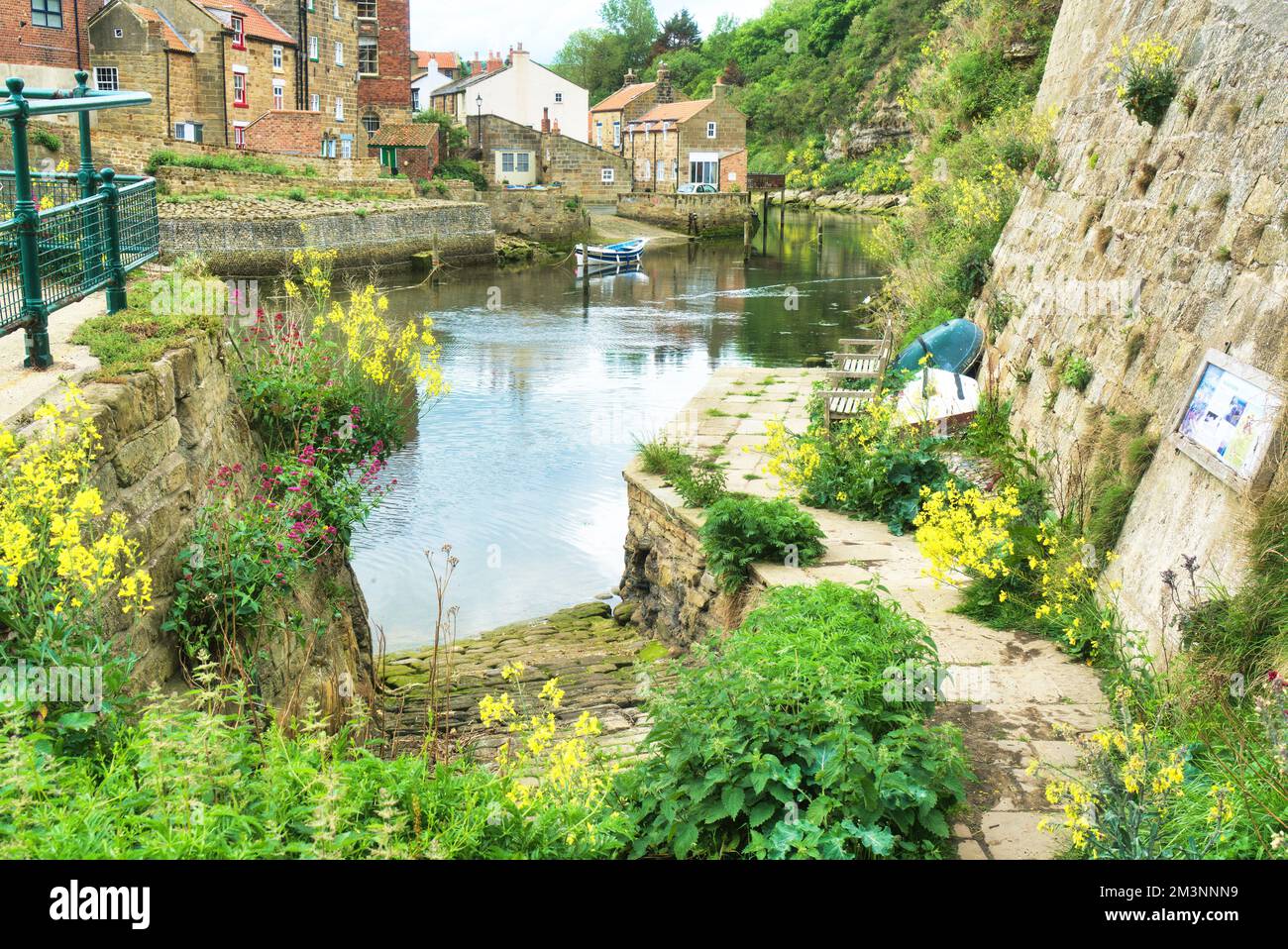 Looking west up Staithes Beck (river) at the quaint ancient fishing ...