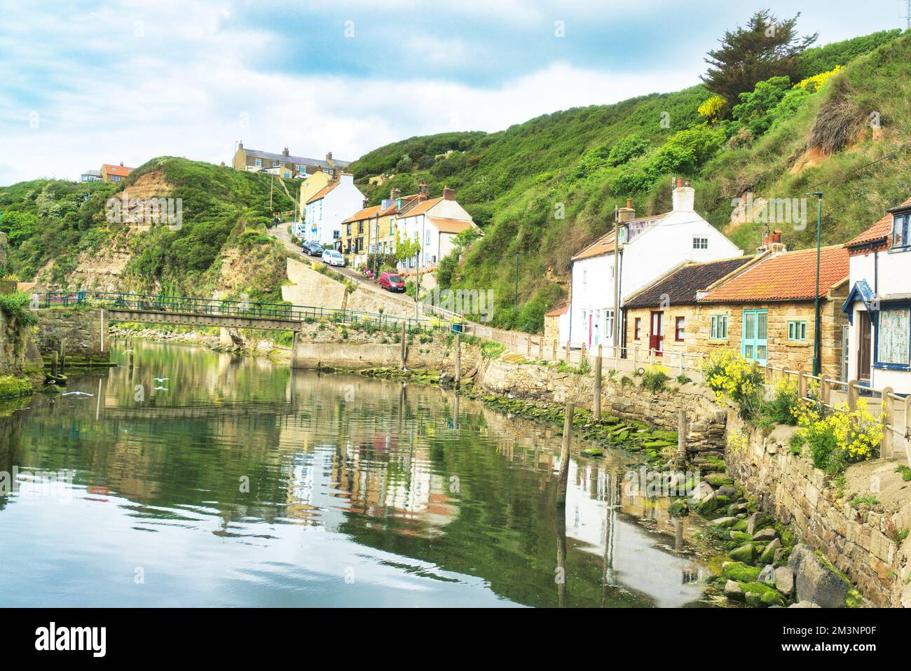Looking west up Staithes Beck (river) at the quaint ancient fishing ...