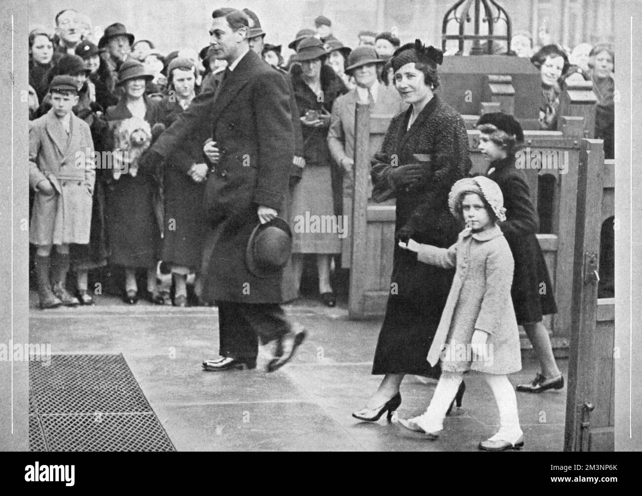 King George VI and Queen Elizabeth enter the gates of St. Mary's Church ...