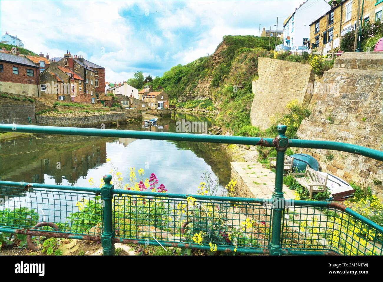 Looking west up Staithes Beck (river) at the quaint ancient fishing ...