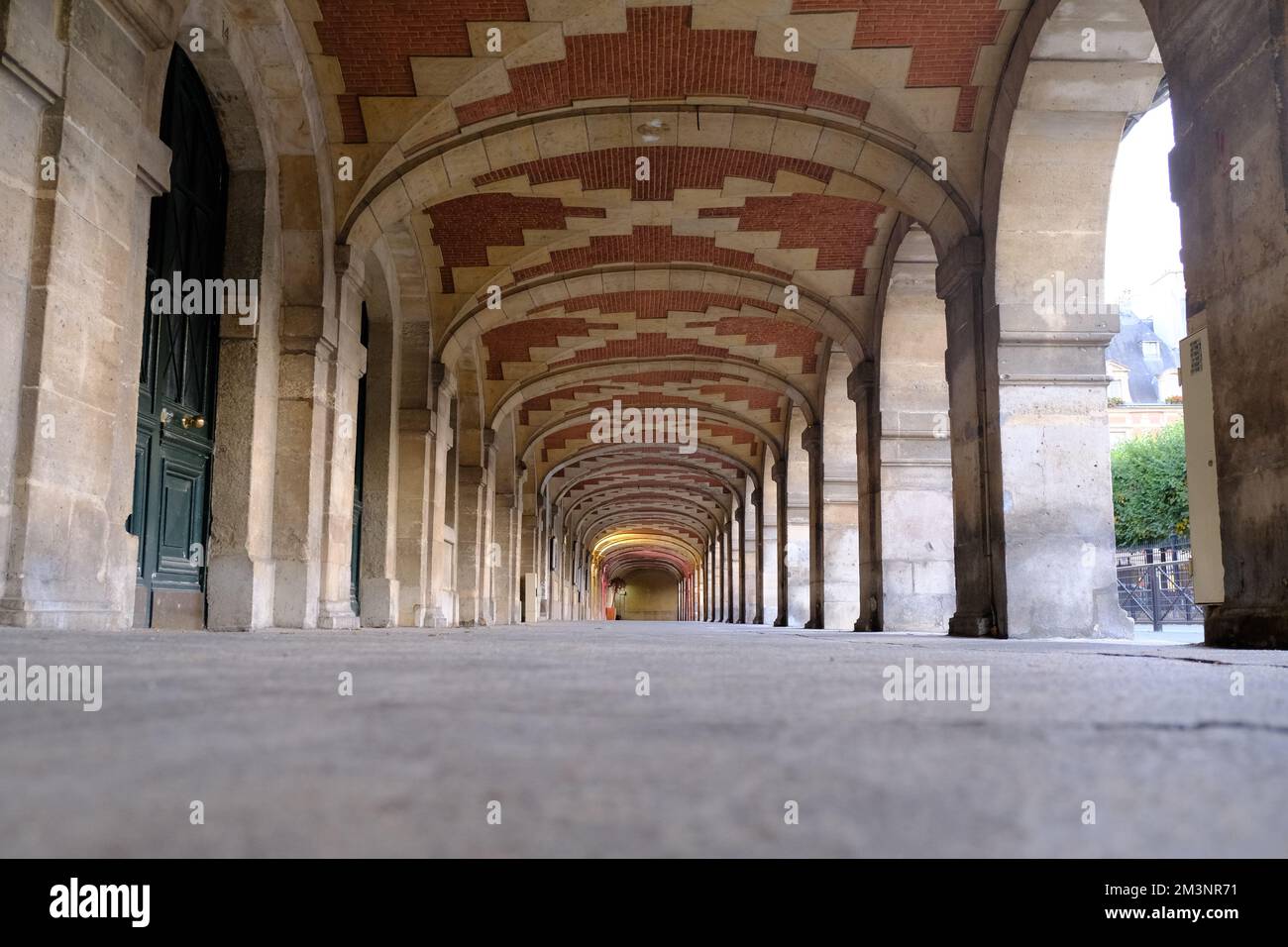 The arches of the historic Place des Vosges in Paris, France Stock ...