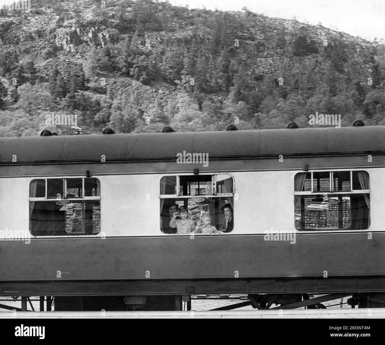 Prince Charles and Princess Anne waving from train Stock Photo - Alamy