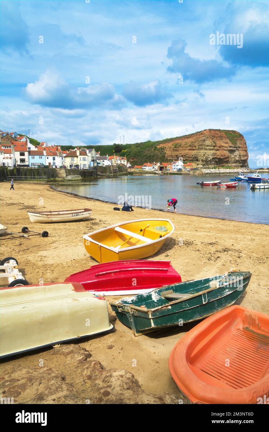 Staithes harbour, beach and cliffs from beach at high tide. North ...