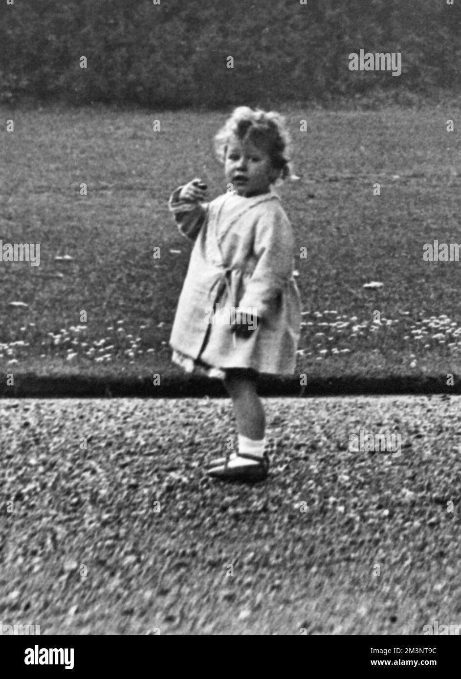 Princess Elizabeth of York (Queen Elizabeth II) at play in the garden ...