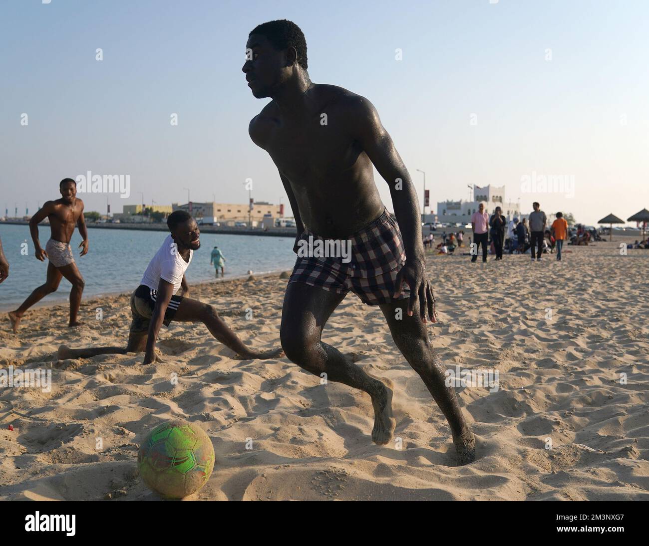 People play football on Al Wakra Beach, Qatar. Picture date: Friday ...