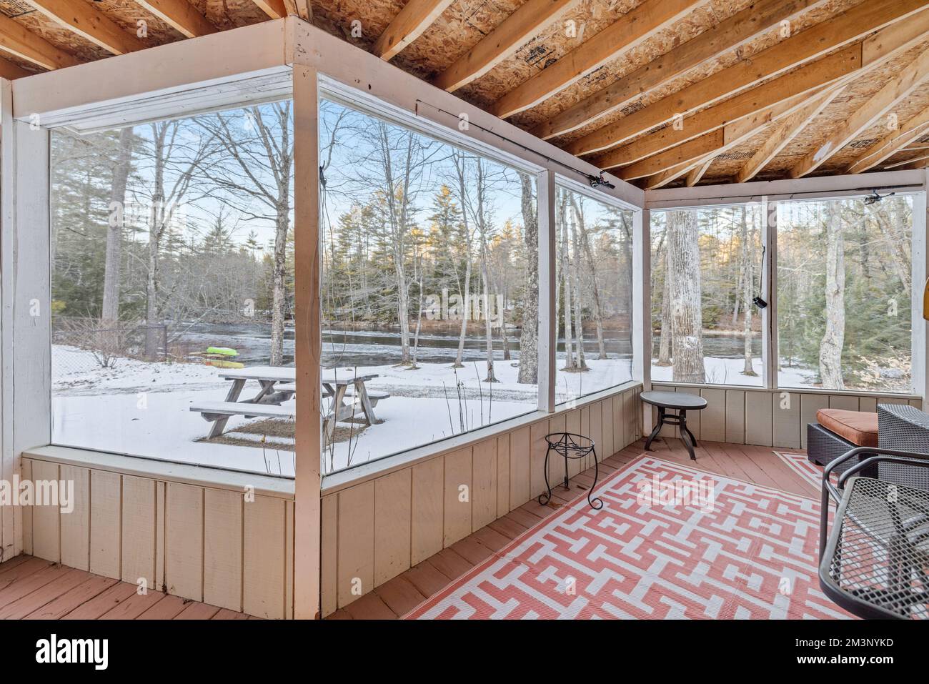 The snowy landscape of a forest behind the windows Stock Photo - Alamy