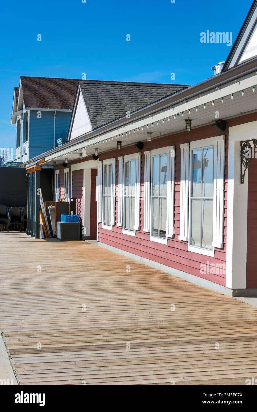 Wood plank pavement in front of office building on sunny day Stock ...