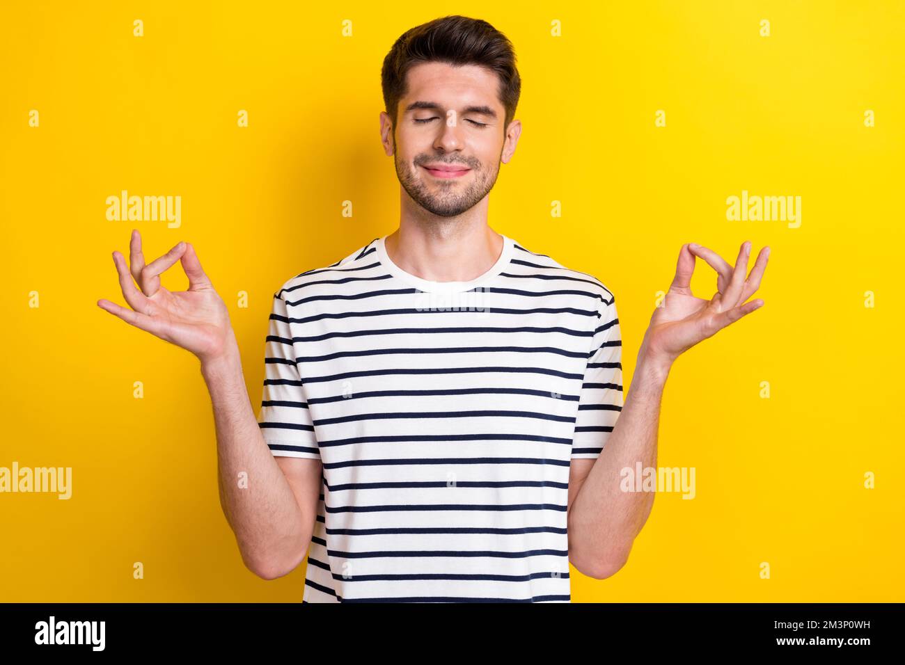 Photo of young relaxed focused student guy wear striped t-shirt fingers ...