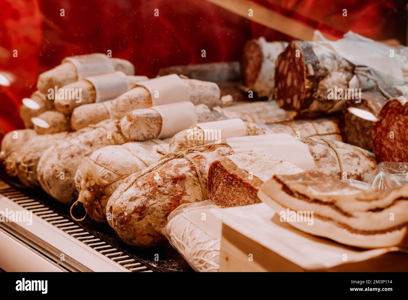 Assortment of smoked sausage and salami in a supermarket. Delicacy and ...