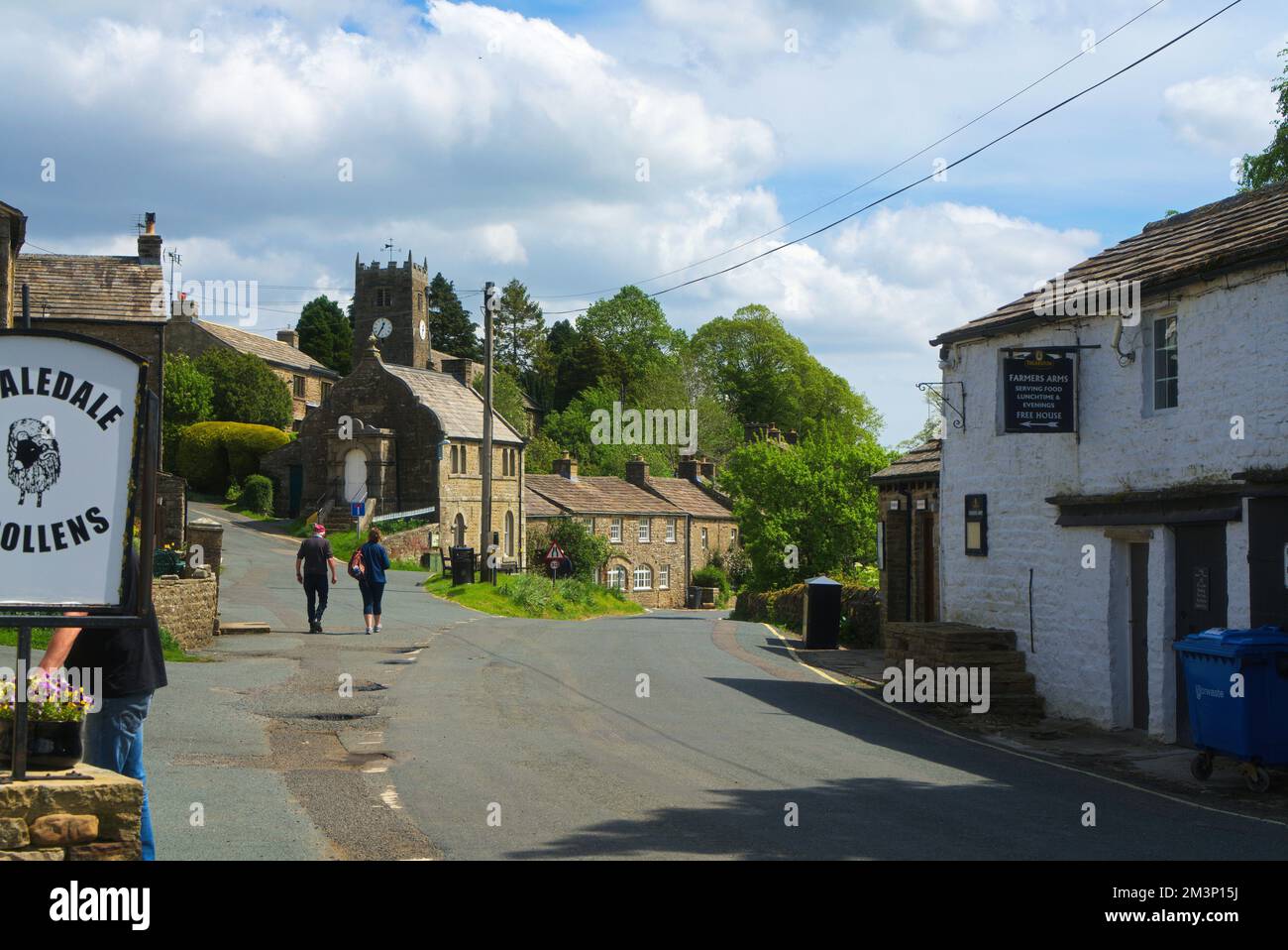 Looking east along Muker village on B6270. Swaledale. Popular tourist ...