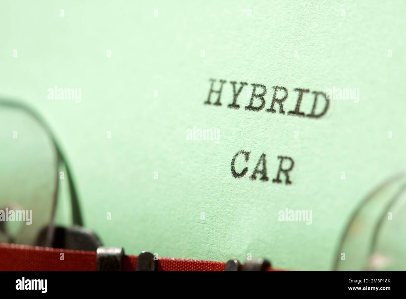 Hybrid car phrase written with a typewriter Stock Photo - Alamy