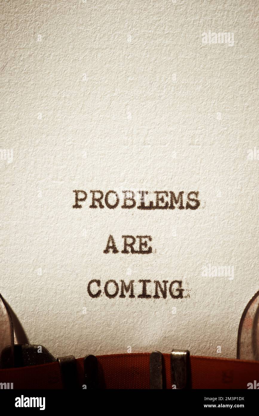 Problems are coming phrase written with a typewriter Stock Photo - Alamy