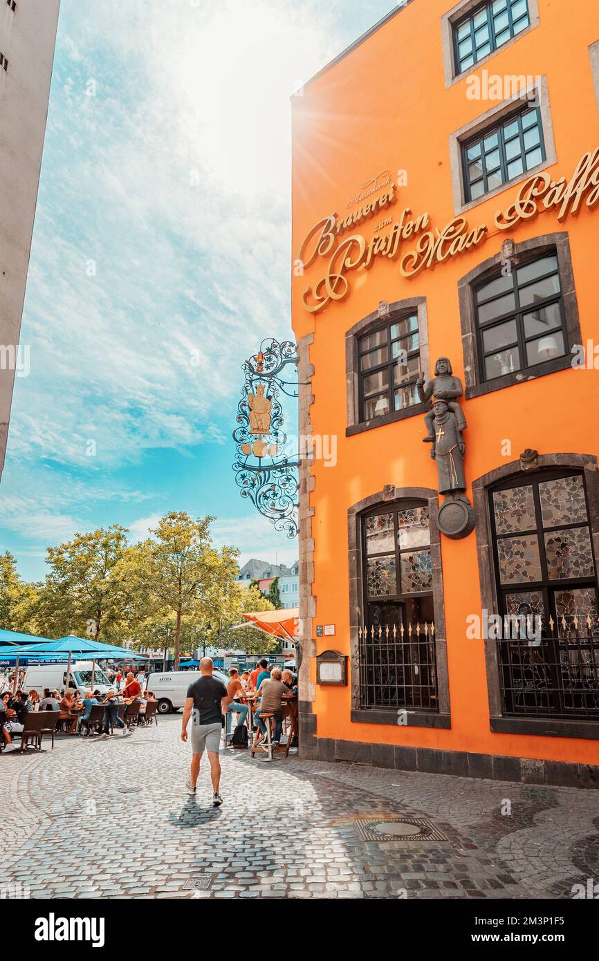 29 July 2022, Cologne, Germany: People walking and resting in cafe on ...