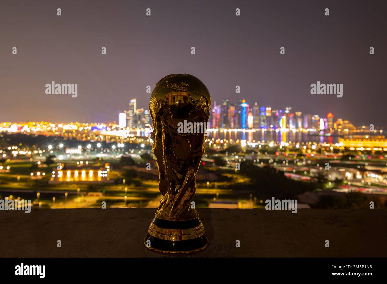 FIFA World cup Qatar 2022 Replica Trophy with Doha Skyline Stock Photo ...