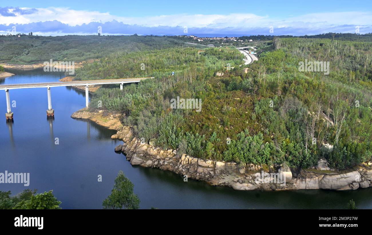 A scenic bridge over a lake in Tabua, Portugal Stock Photo - Alamy