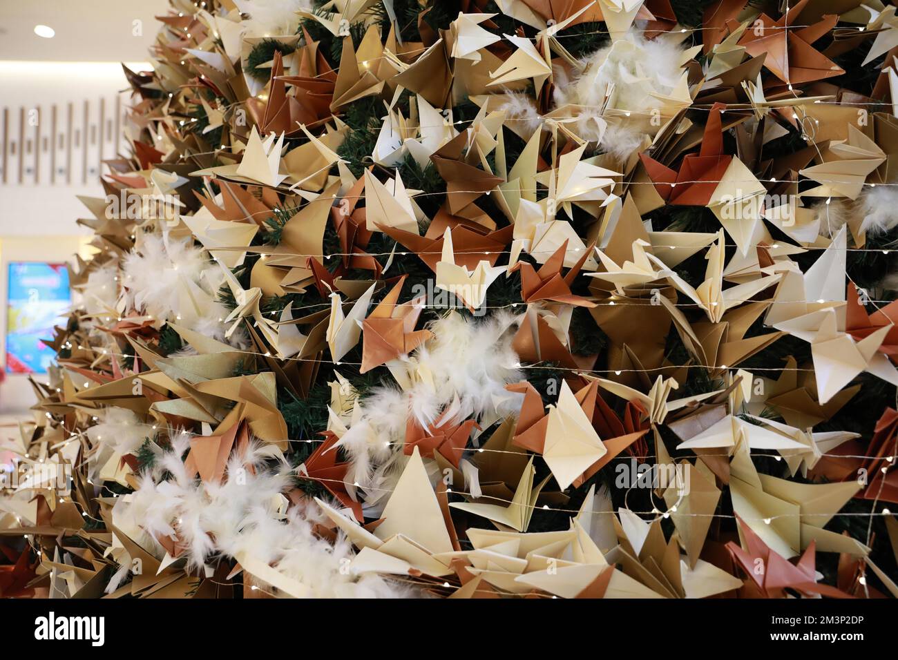 A giant Christmas tree decorated with tens of thousands of paper cranes ...