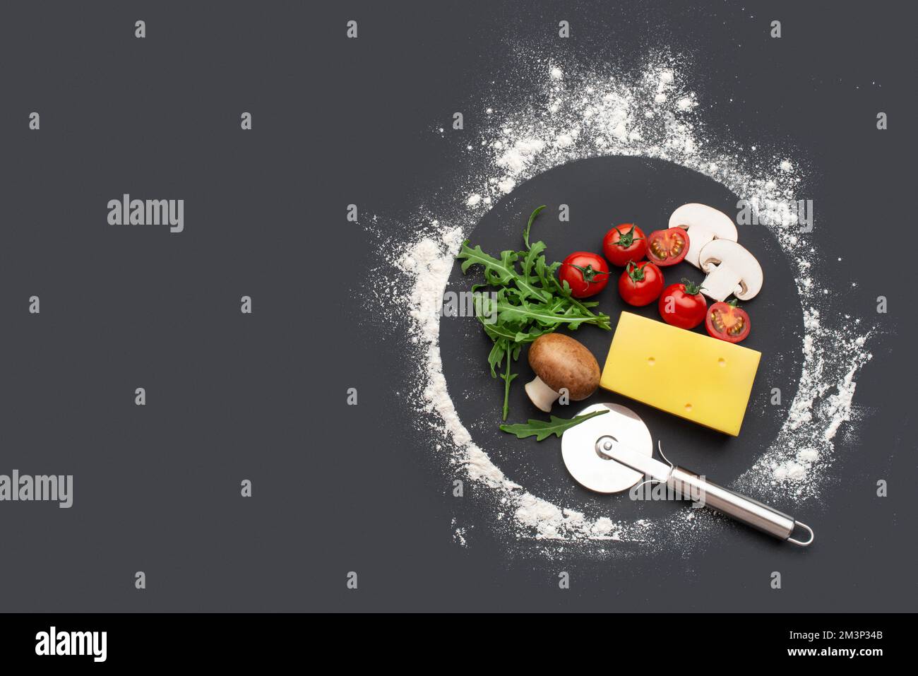 Black background with pizza ingredients Stock Photo - Alamy