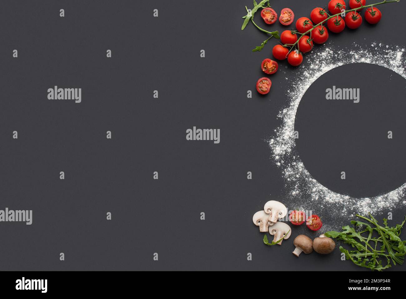 Black background with pizza ingredients Stock Photo - Alamy