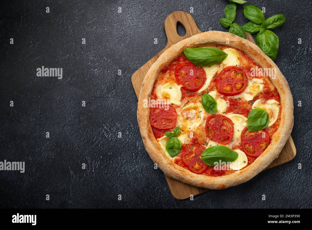 margarita pizza on black background Stock Photo - Alamy