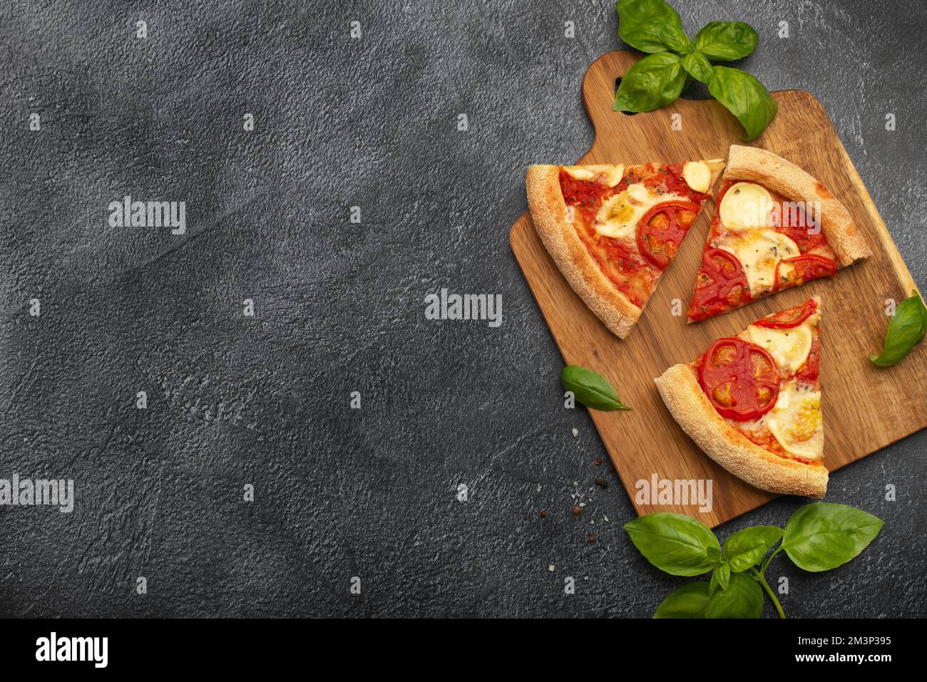 margarita pizza on black background Stock Photo - Alamy