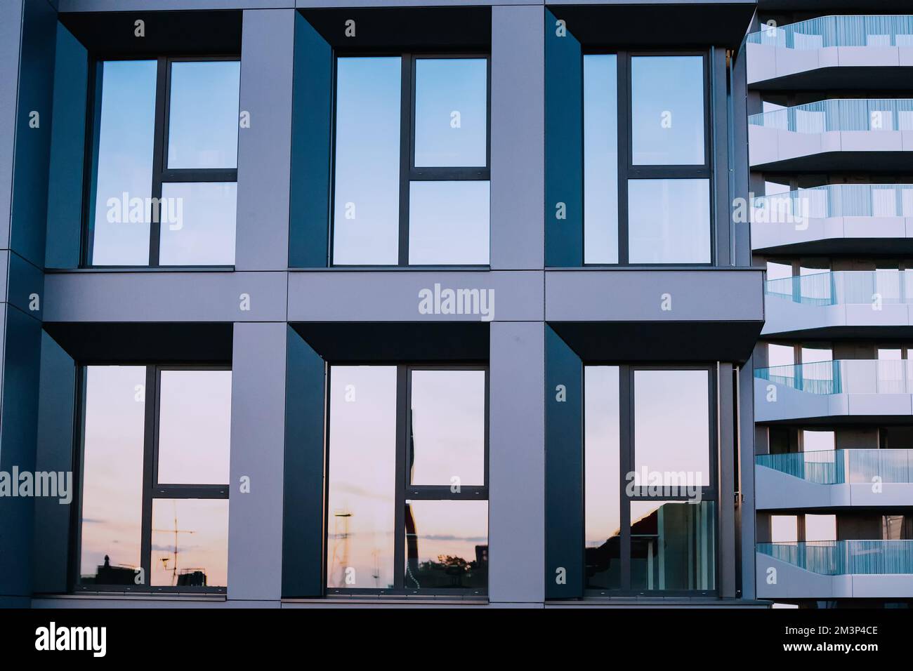 Abstract night view of business skyscraper building Stock Photo - Alamy