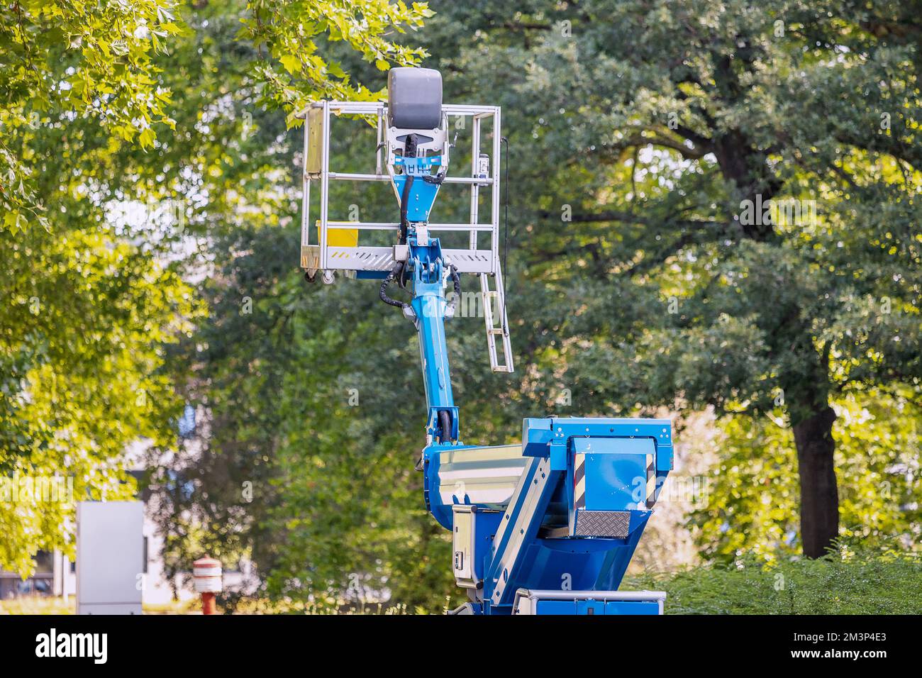 Industrial telescopic unmanned crane with basket at city park Stock ...
