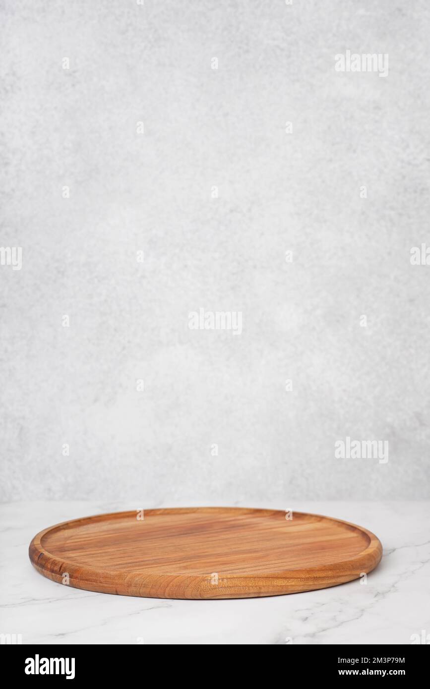 light culinary background with round wooden board Stock Photo - Alamy