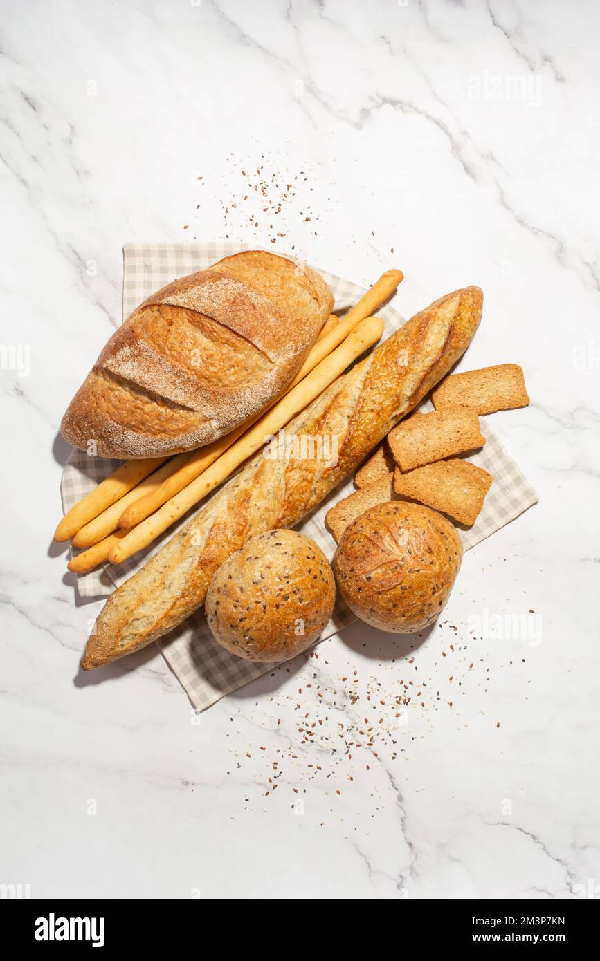 Background with different types of fresh bread. Bakery products ...
