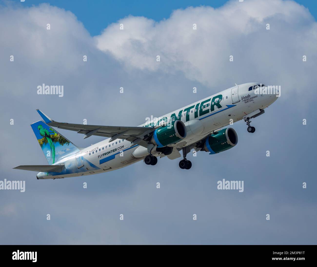 The Frontier Airbus A320 flying in the cloudy sky Stock Photo - Alamy