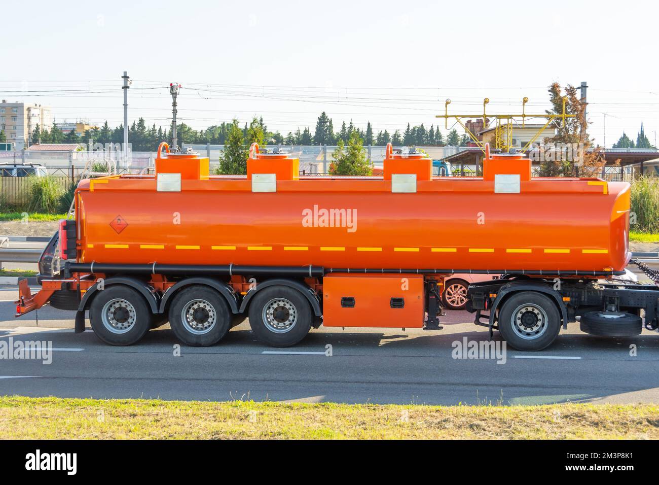 Big orange metal fuel tanker truck shipping fuel Stock Photo - Alamy