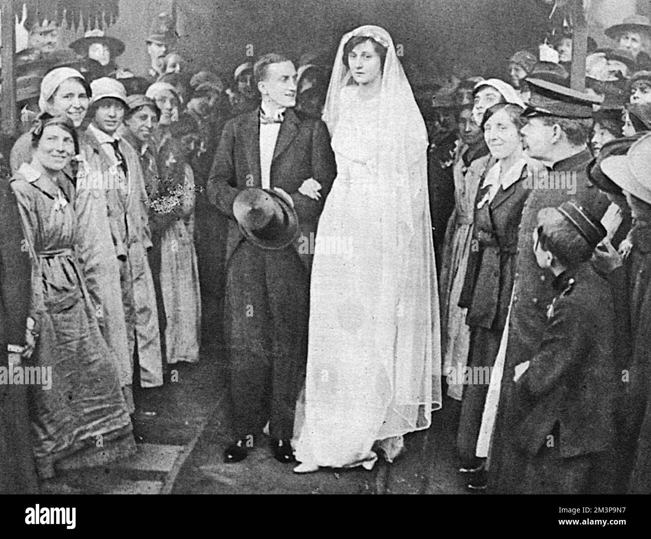 Munition workers guard of honour at Percy wedding, WW1 Stock Photo - Alamy