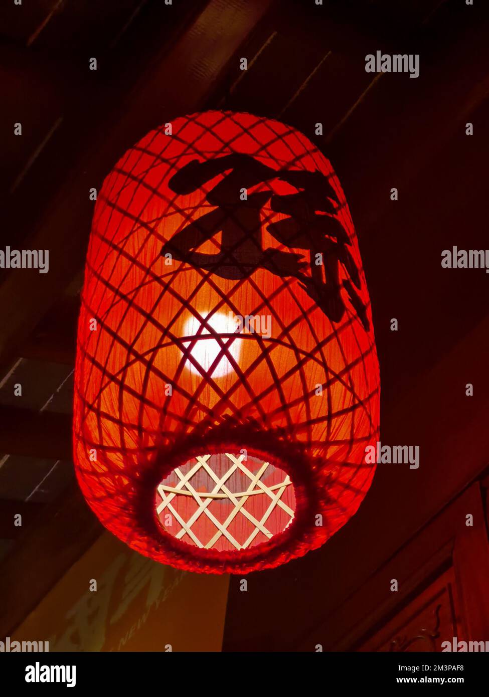 A vertical of a hanging Chinese lantern Stock Photo - Alamy
