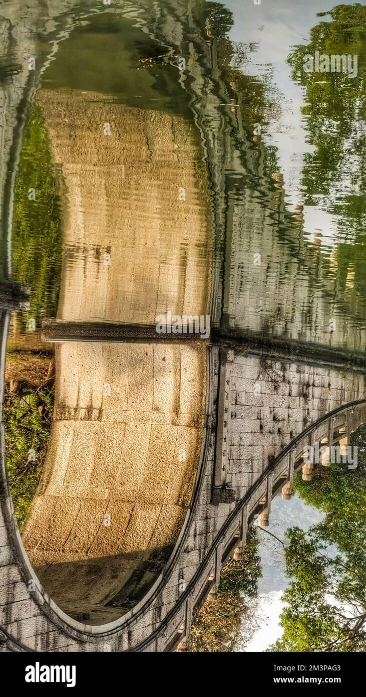 A vertical reflection of a bridge in the Xianghu Lake Stock Photo - Alamy