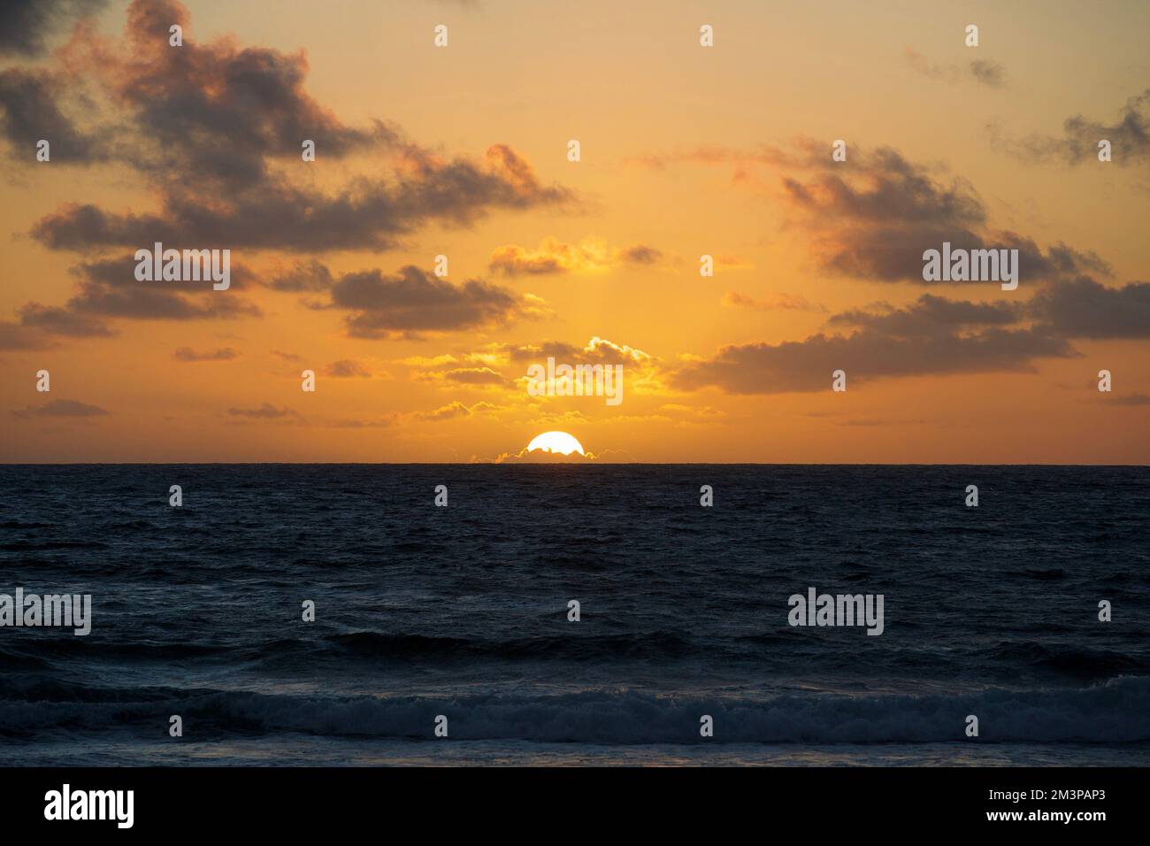 A beautiful golden sunset over the sea Stock Photo - Alamy