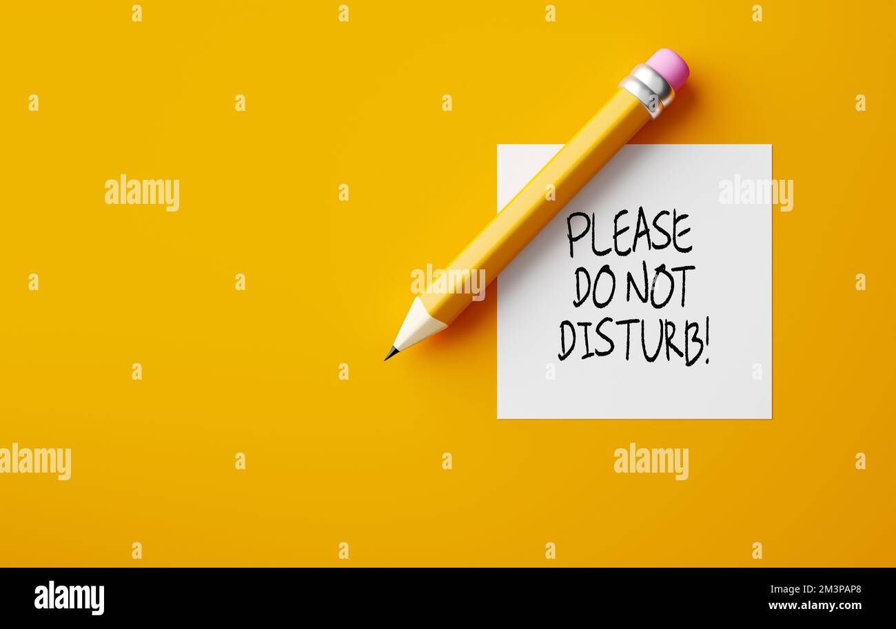 Pencil and a note paper with the message do not disturb on yellow ...