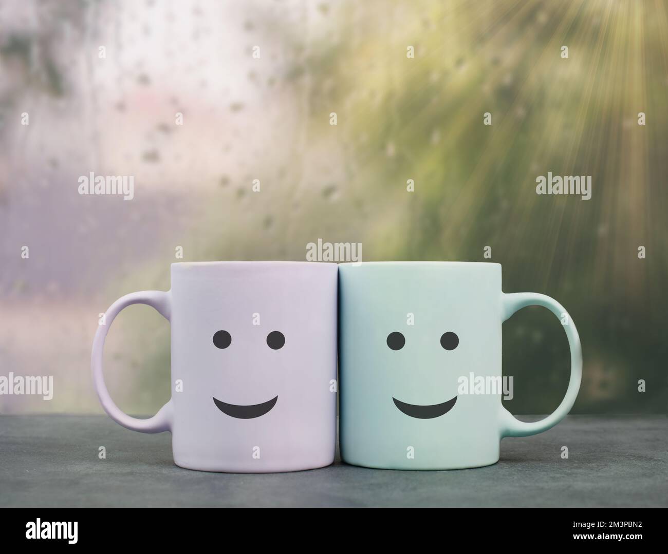 Happy, similing face, mug couple on a window sill cuddle, cup of coffee ...