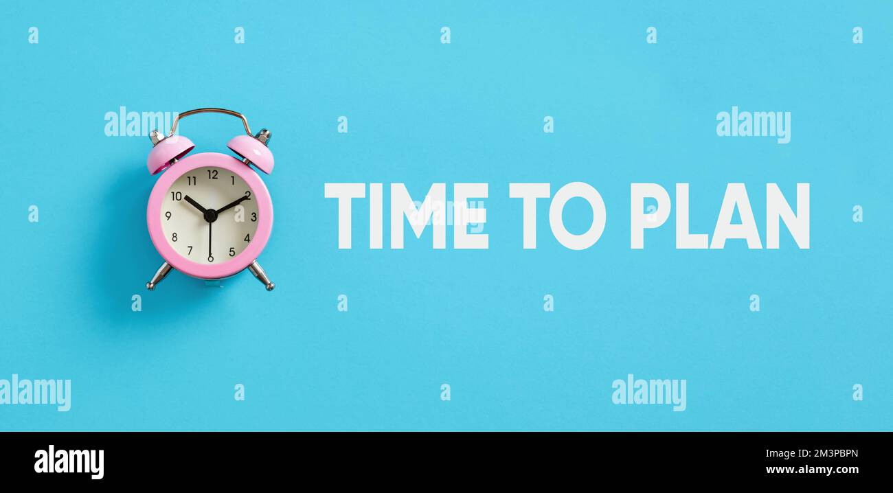 Planning for business. Preparing business plan. Pink alarm clock on ...
